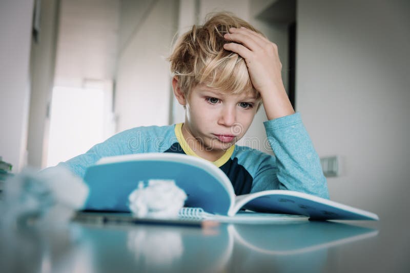 Difficult Homework- Little Boy Having Problems with Reading Stock Photo ...