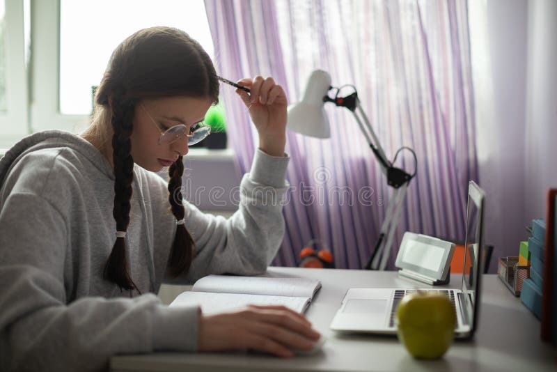 A Difficult School Assignment To Solve. a Teenage Girl Learns. Stock ...