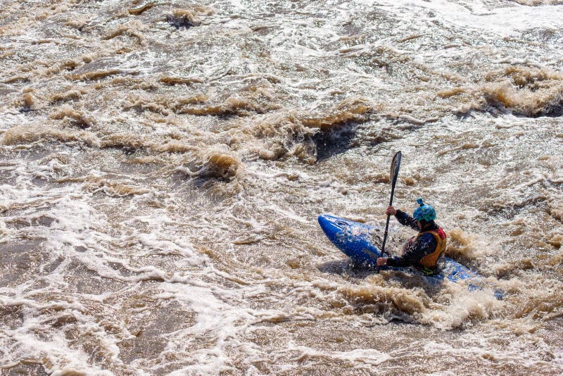 A Difficult Section on the River is Overcome by a Man on a Kayak ...