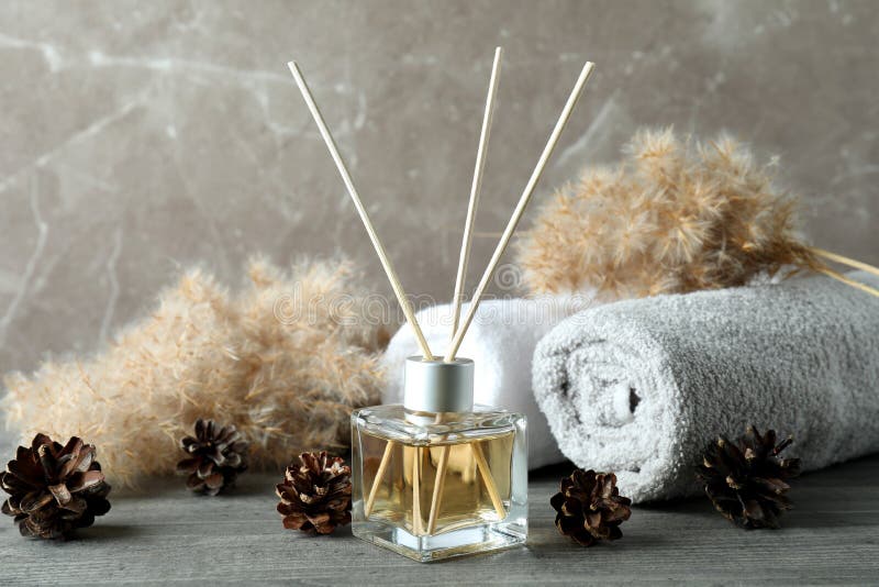 Diffuser and Bath Accessories on Gray Textured Table Stock Image ...