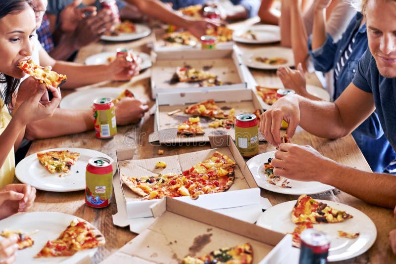 Dig in. a Group of Friends Enjoying Pizza Together. Stock Photo - Image ...