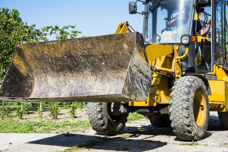 Digger in a backyard stock photo. Image of dirt, excavator - 41801498