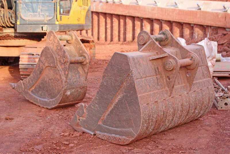 Digger Buckets on a Construction Site Stock Photo - Image of plant ...