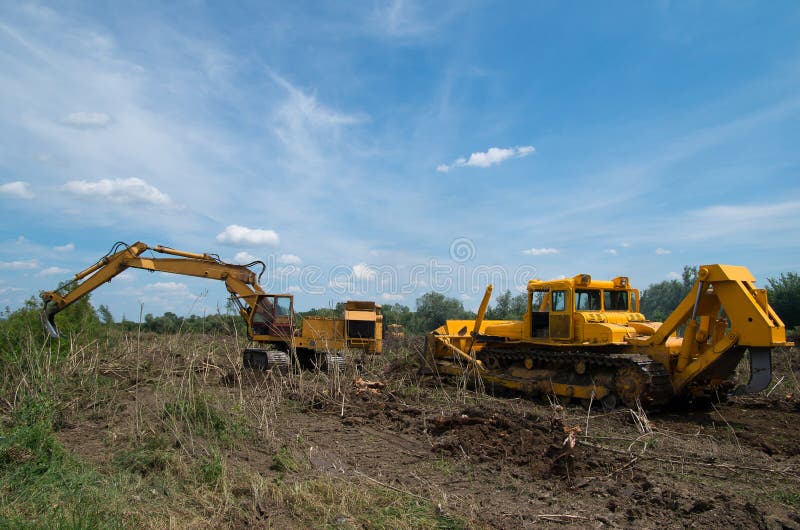 Digger and Bulldozer Clearing Forest Land. Stock Photo - Image of ...