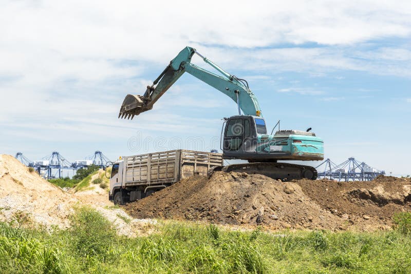 Digger Car Load and Transfer Soil To Truck on the Hill, Technology ...