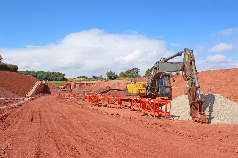 Digger on a Construction Site Stock Photo - Image of site, gravel ...