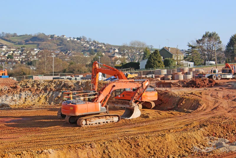 Digger on a Construction Site Stock Photo - Image of machinery, diggers ...