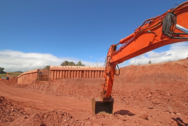 Digger on a Construction Site Stock Photo - Image of earth, plant ...