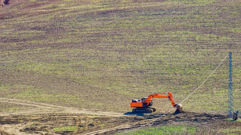 Digger excavator on field stock image. Image of machine - 378693071