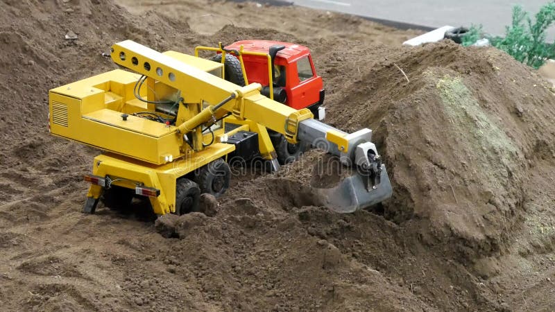 Digger Excavator Machinery Digging Action in Construction Site. Stock ...