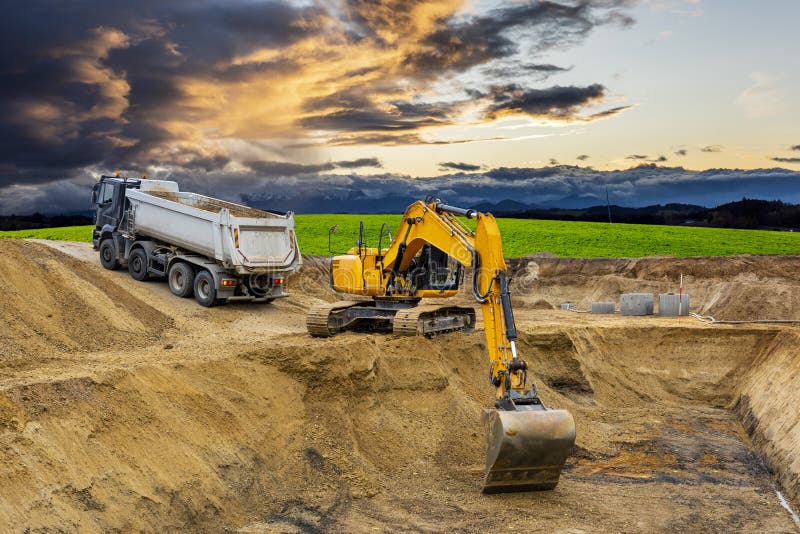 Digger and Excavator at Work in Construction Site Stock Image - Image ...