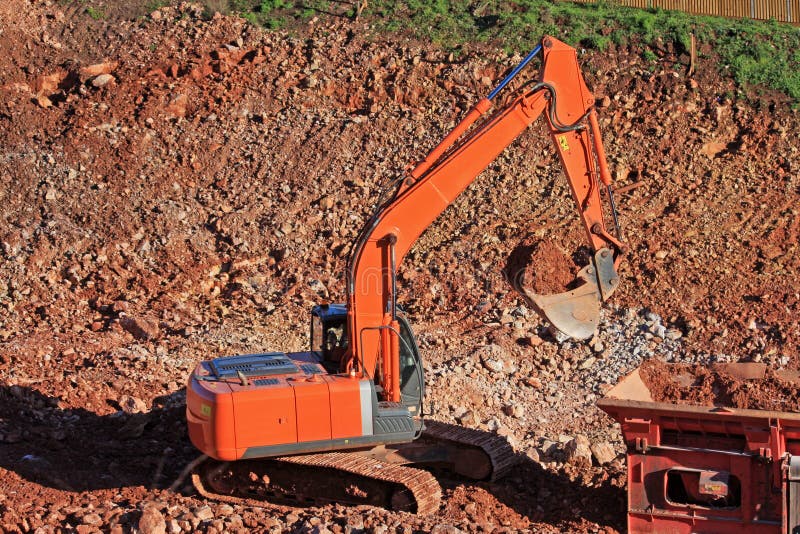 Digger Loading a Dump Truck Stock Photo - Image of construction ...