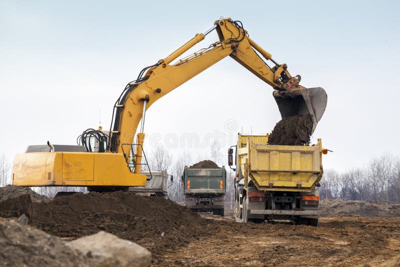 Digger Loading Trucks with Soil Stock Photo - Image of digger, load ...