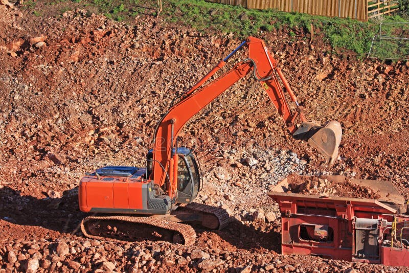 Digger Loading a Dump Truck Stock Image - Image of tracks, building ...