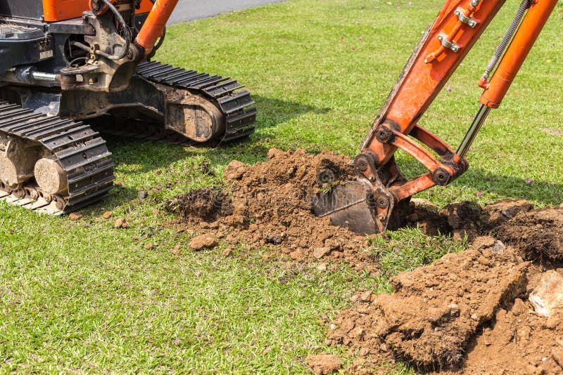 Digger Machine Operate for Digging Soil and Repair Road in the P Stock ...
