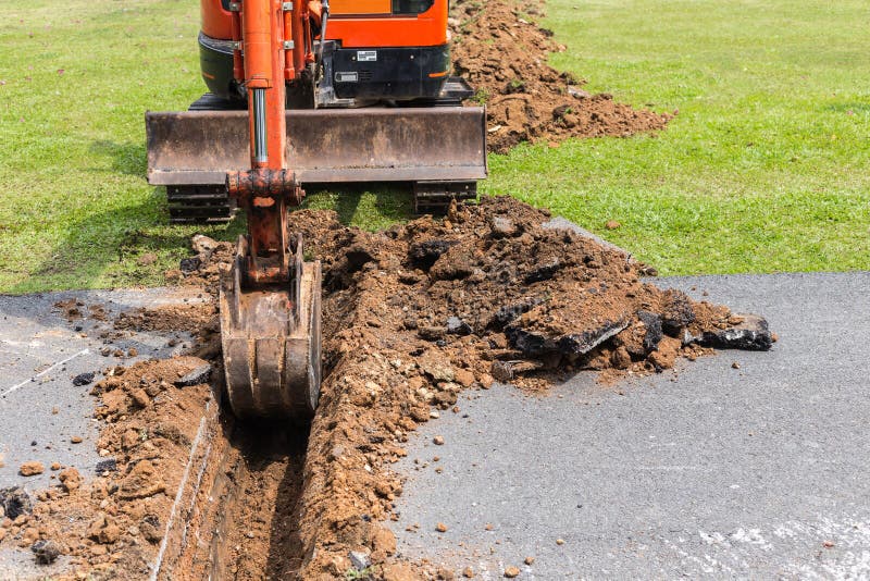 Digger Machine Operate for Digging Soil and Repair Road in the P Stock ...