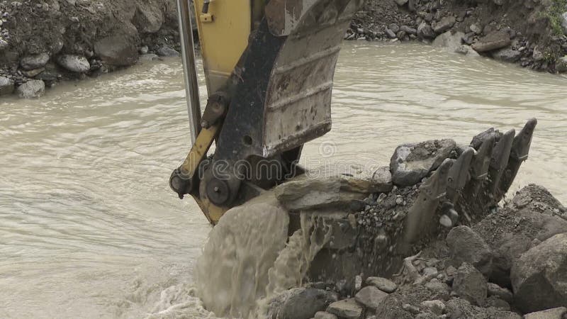 Digger moving rocks stock footage. Video of rocks, excavating - 42380890