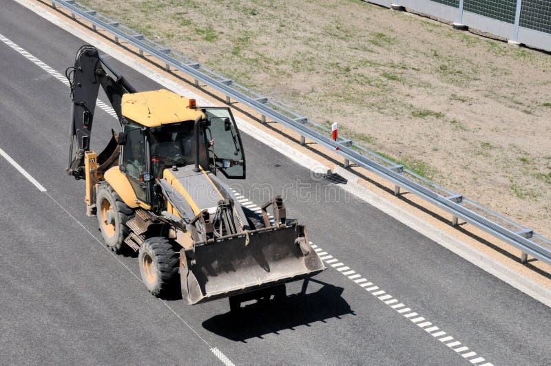 Digger on the road stock photo. Image of excavator, transportation ...