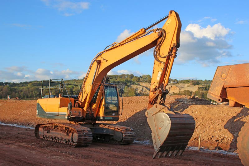 Digger on a Road Construction Site Stock Photo - Image of rural ...