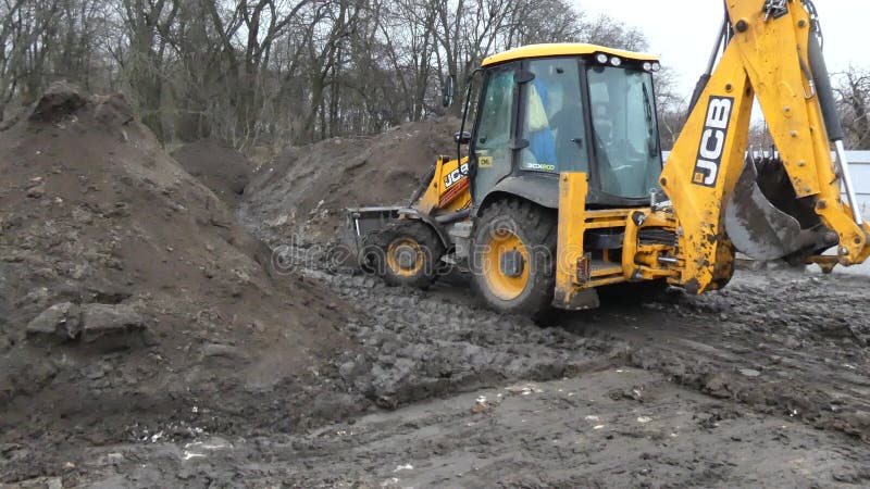 Digger Working in the Mud Clearing the Ground at the Construction ...