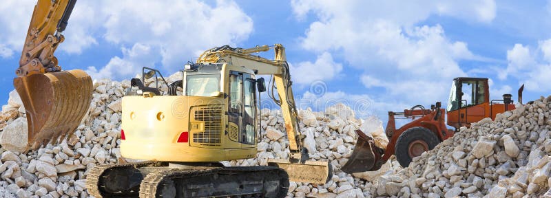 Diggers Building a Dam of White Stones on a Construction Site Stock ...