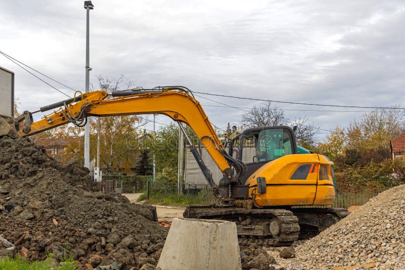 Digging Dirt Excavator stock photo. Image of hydraulic - 263961364