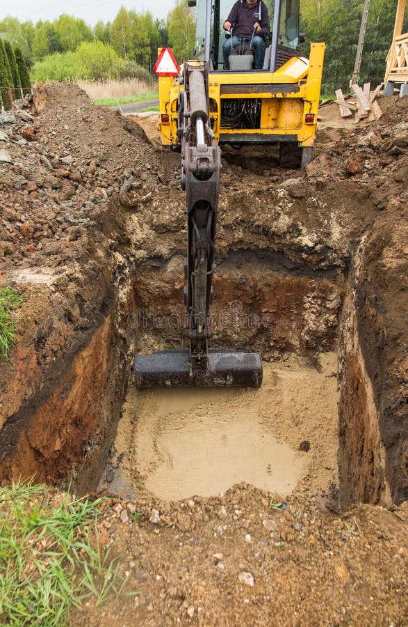Digging and Leveling the Bottom of the Backyard Septic Tank Stock Photo ...