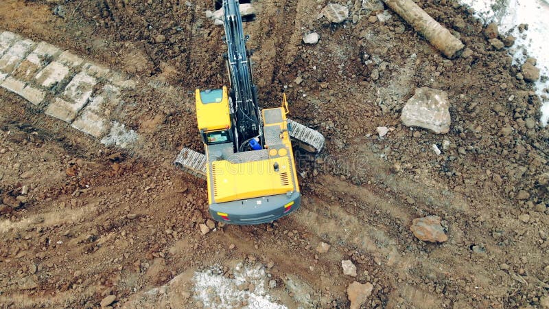 Digging Loader is Transporting Stones in a Top View. Excavator Digging ...