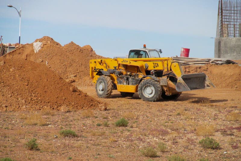 Digging machine working editorial image. Image of farmer - 78101765