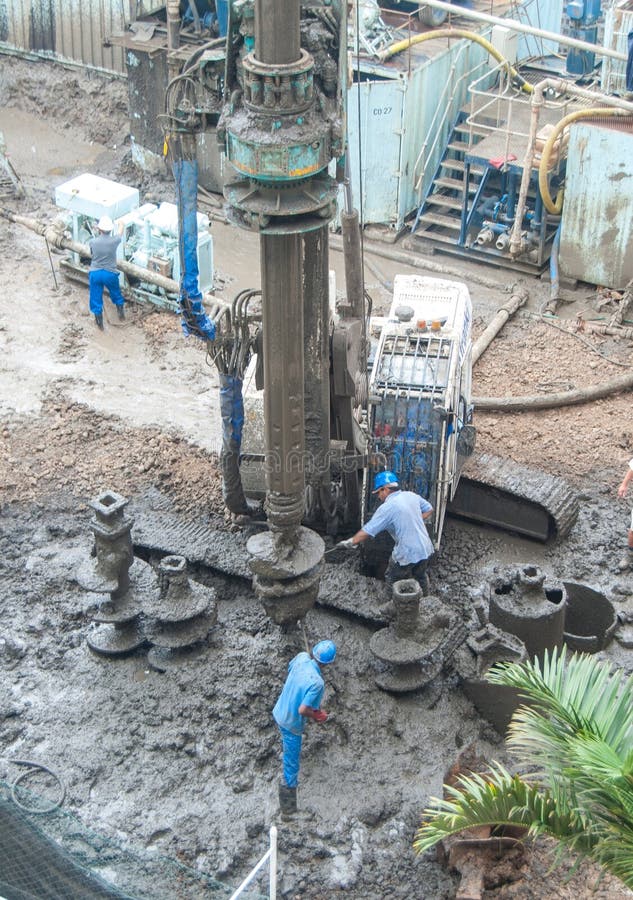 Digging through Muddy Ground with Drilling Crane Heavy Equipment ...