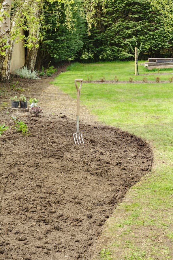 Digging over a flower bed stock image. Image of bare - 129684367