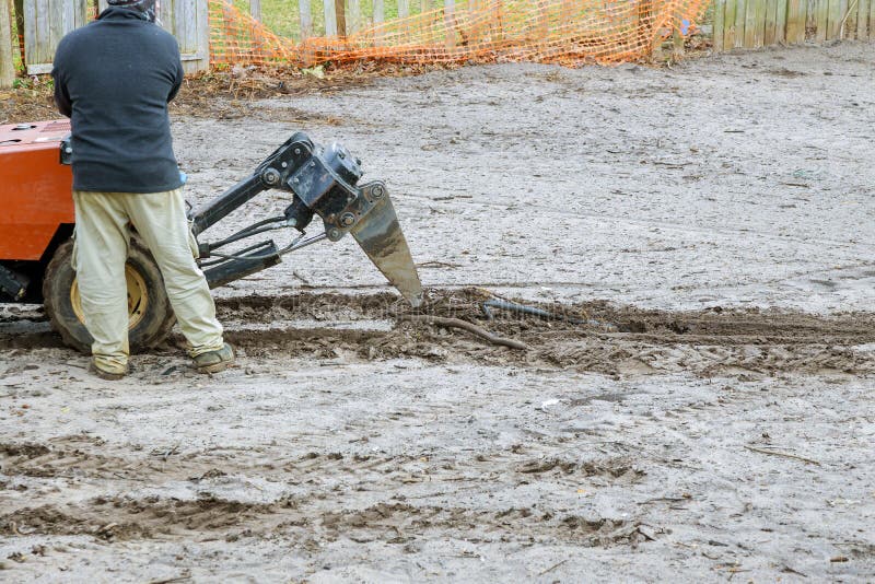 Digging a Pipe in the Workers Installing Irrigation Watering System ...