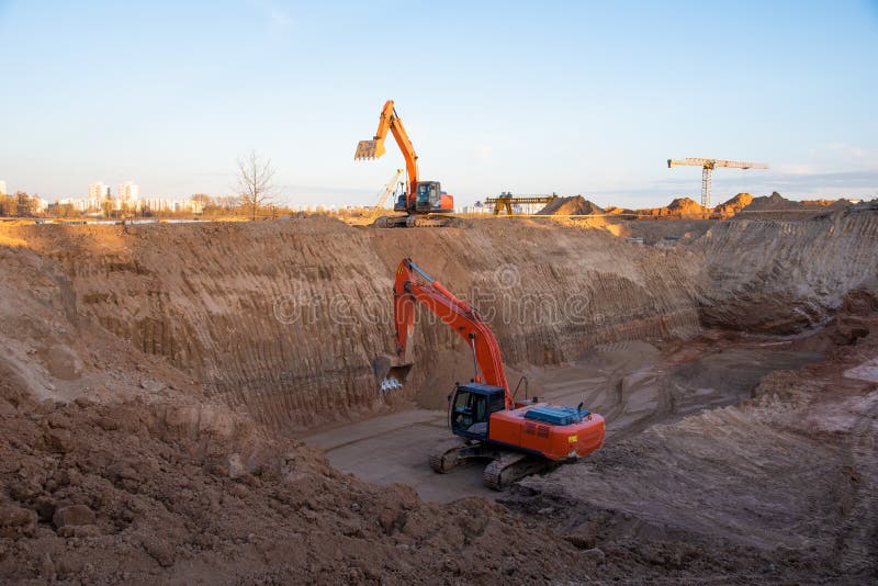 Digging the Pit Foundation a Hole with Excavator. Earthwork in ...