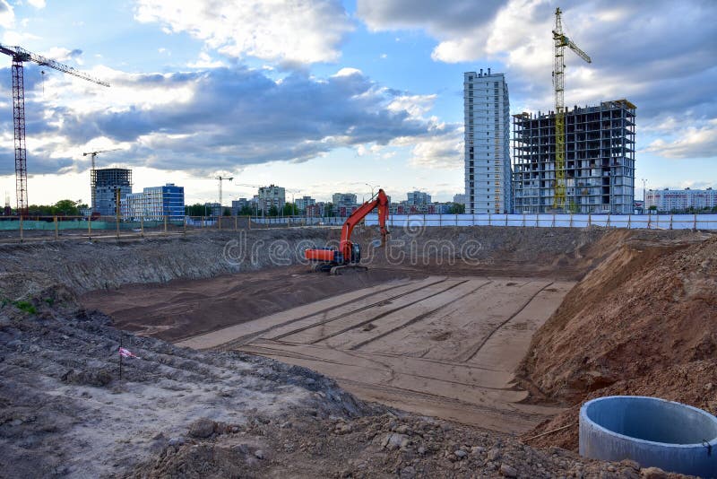 Digging the Pit Foundation a Hole with Excavator. Earthwork in ...