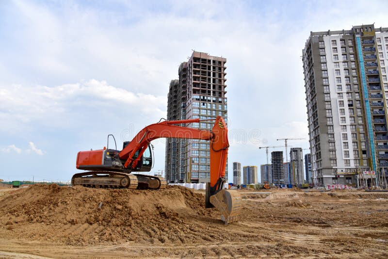 Digging the Pit Foundation a Hole with Excavator. Earthwork in ...