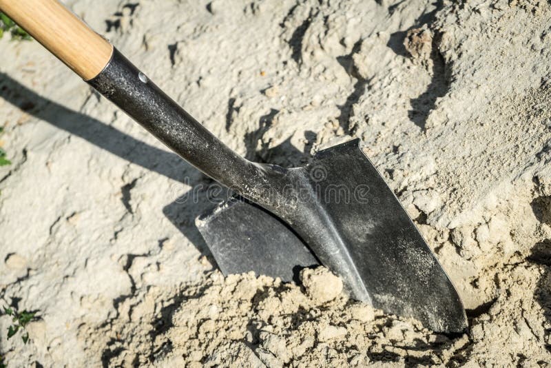 Digging Sand with a Shovel. Place for Your Text Stock Photo - Image of ...