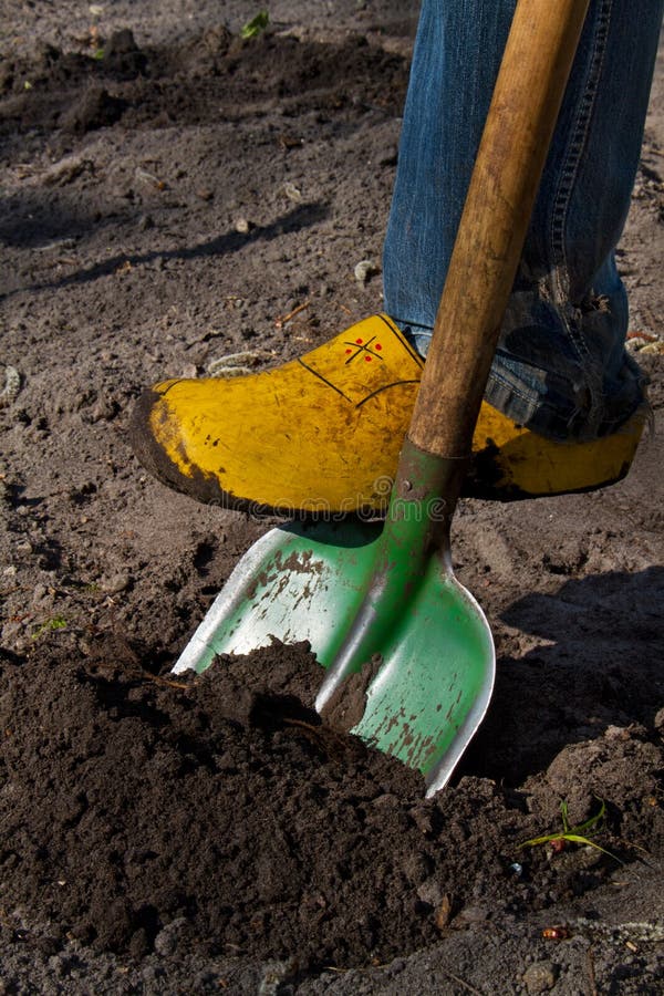 Digging the soil stock photo. Image of digging, wearing - 89459914