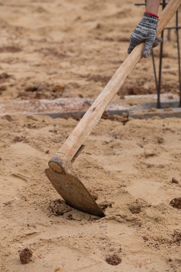 Digging the Soil with a Hoe Stock Image - Image of hole, labor: 64869959