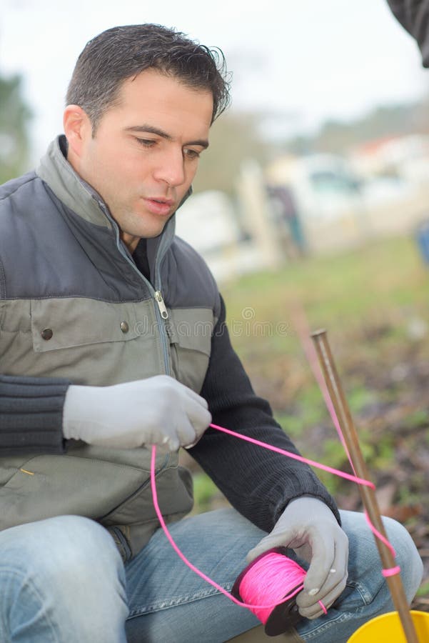 Digging Trench with Aid String Line Stock Photo - Image of skill ...
