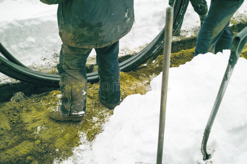 Digging a Trench for Electrical Cable Stock Photo - Image of snow ...