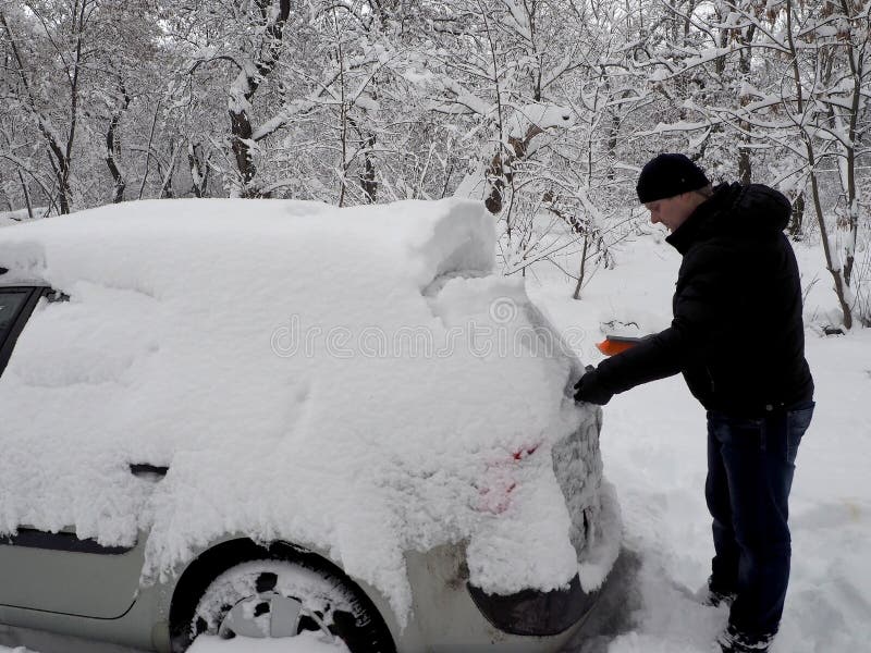 Digging up a snow machine stock photo. Image of snowblower - 136457176