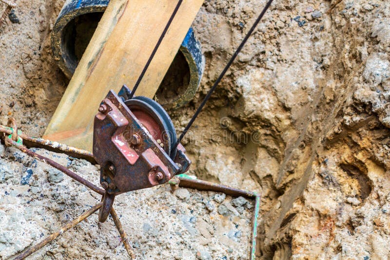 Digging a Well, Crane Hook Lifts the Ground from the Pit Stock Photo ...