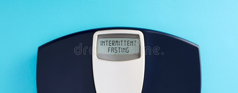 Digital Bathroom Scale with the Word Intermittent Fasting on Blue ...