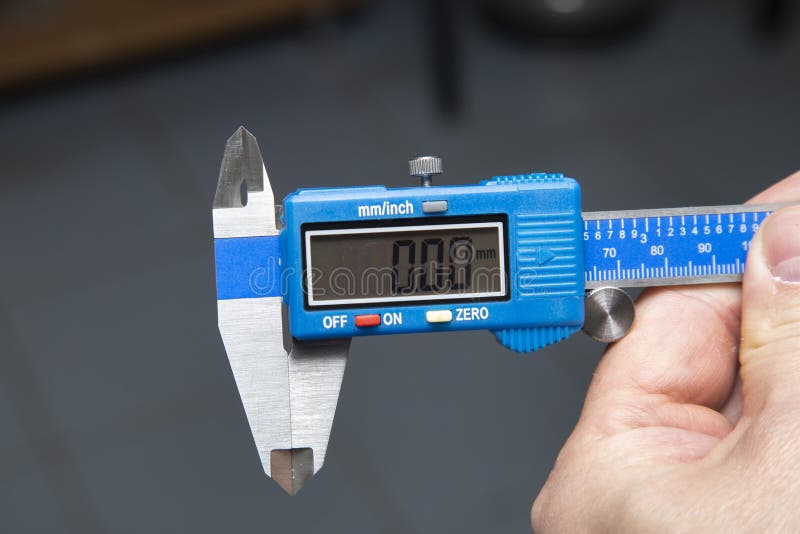 Digital Caliper in the Hands of the Master Stock Photo - Image of ...
