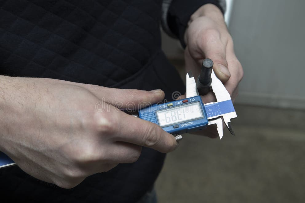 Digital Caliper in the Hands of the Master Stock Image - Image of ...