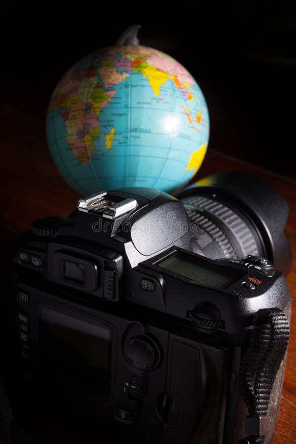 Digital camera with globe. stock photo. Image of instrument - 46584294