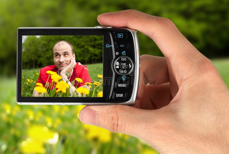 Digital camera in a hand stock image. Image of technology - 21682645
