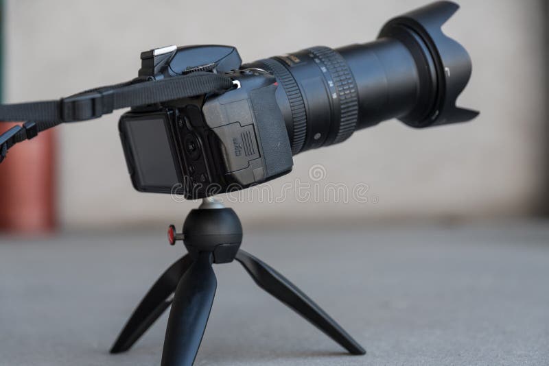 SLR Camera on a Small Tripod Stock Image - Image of shoot, lens: 176077989
