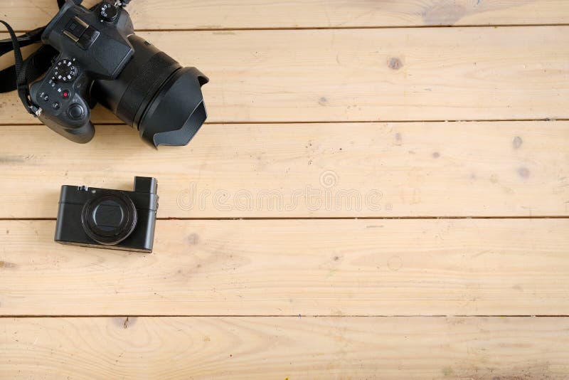 Digital Cameras on the Wooden Table Stock Image - Image of photographer ...