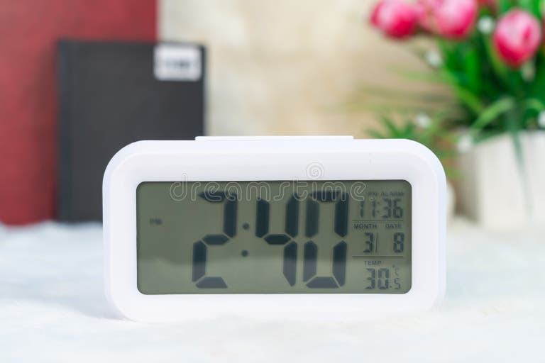 Digital Clock with Book Decorated on Table Stock Photo - Image of room ...